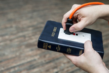 Stock Photo - Electrical outlet on the holy bible. by Image 1:27 ...