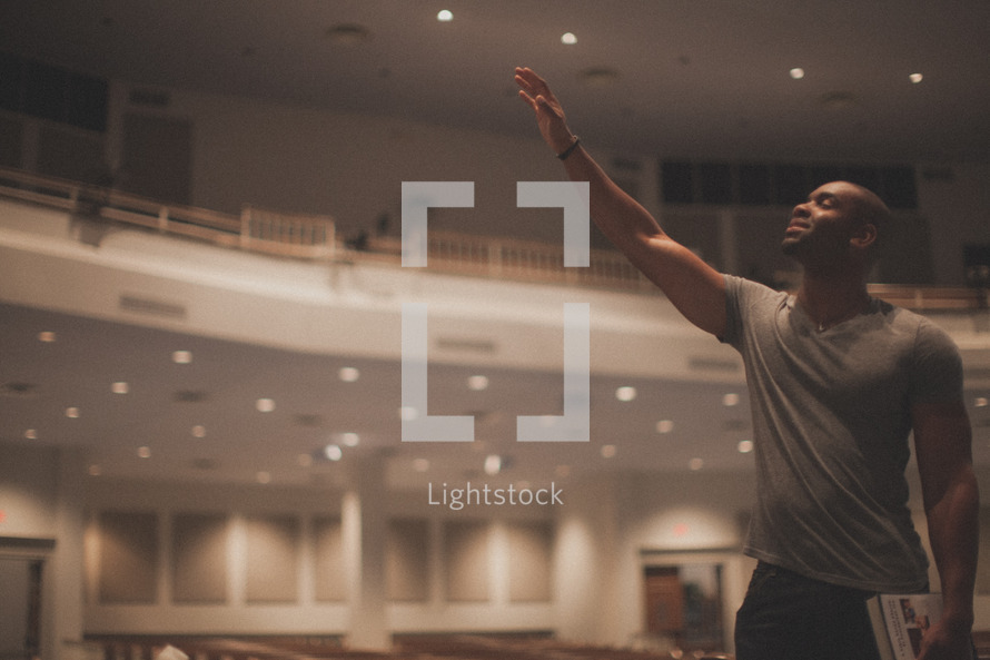 Stock Photo - Man standing in a church looking up to god by Pearl ...