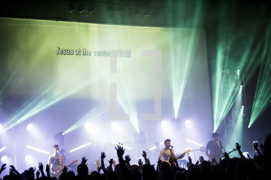 Silhouette of audience at a Christian rock concert.